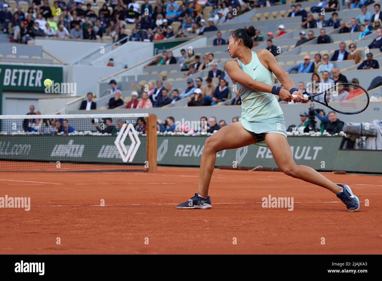Paris, France. 30th May, 2022. Zheng Qinwen returns a shot during the women's singles fourth ...