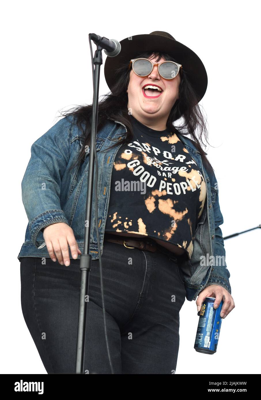 Singer Julie Rhodes is shown performing on stage during a live concert ...
