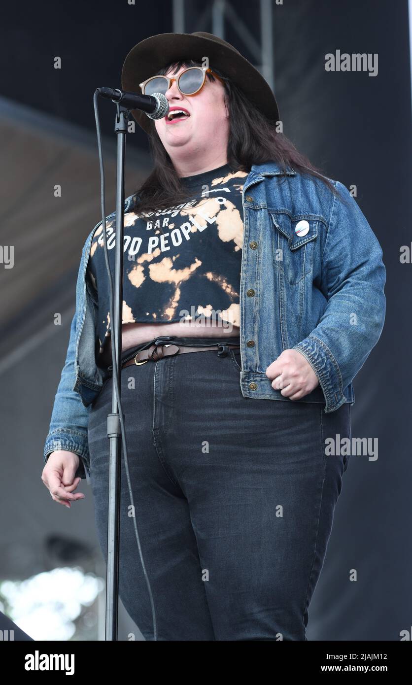 Singer Julie Rhodes is shown performing on stage during a live concert ...