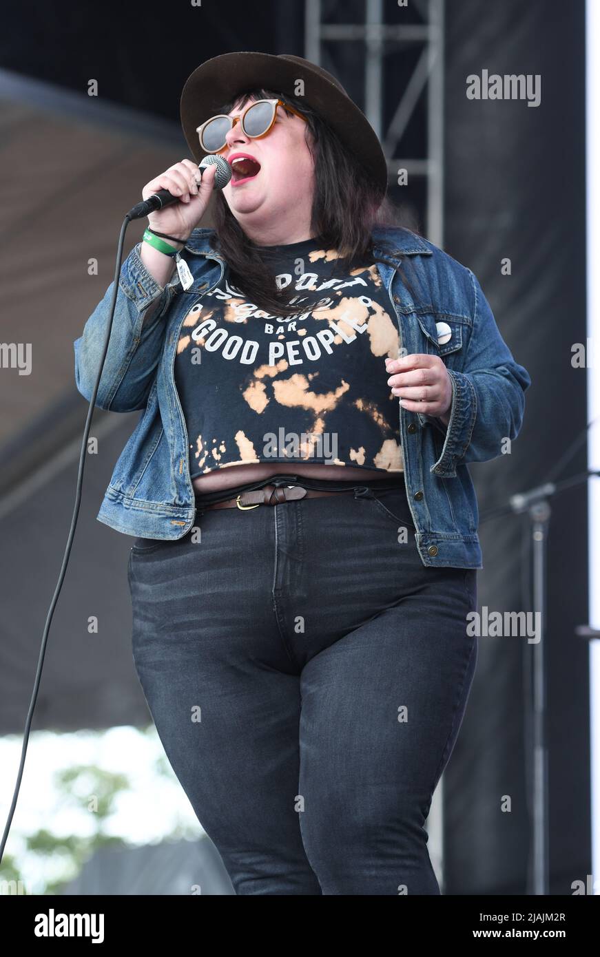 Singer Julie Rhodes is shown performing on stage during a live concert ...