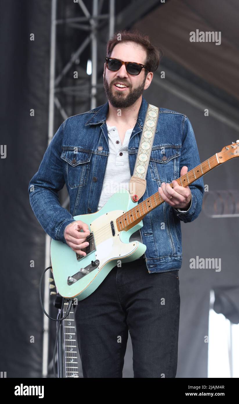 The lead guitarist in the Julie Rhodes band is shown performing on ...