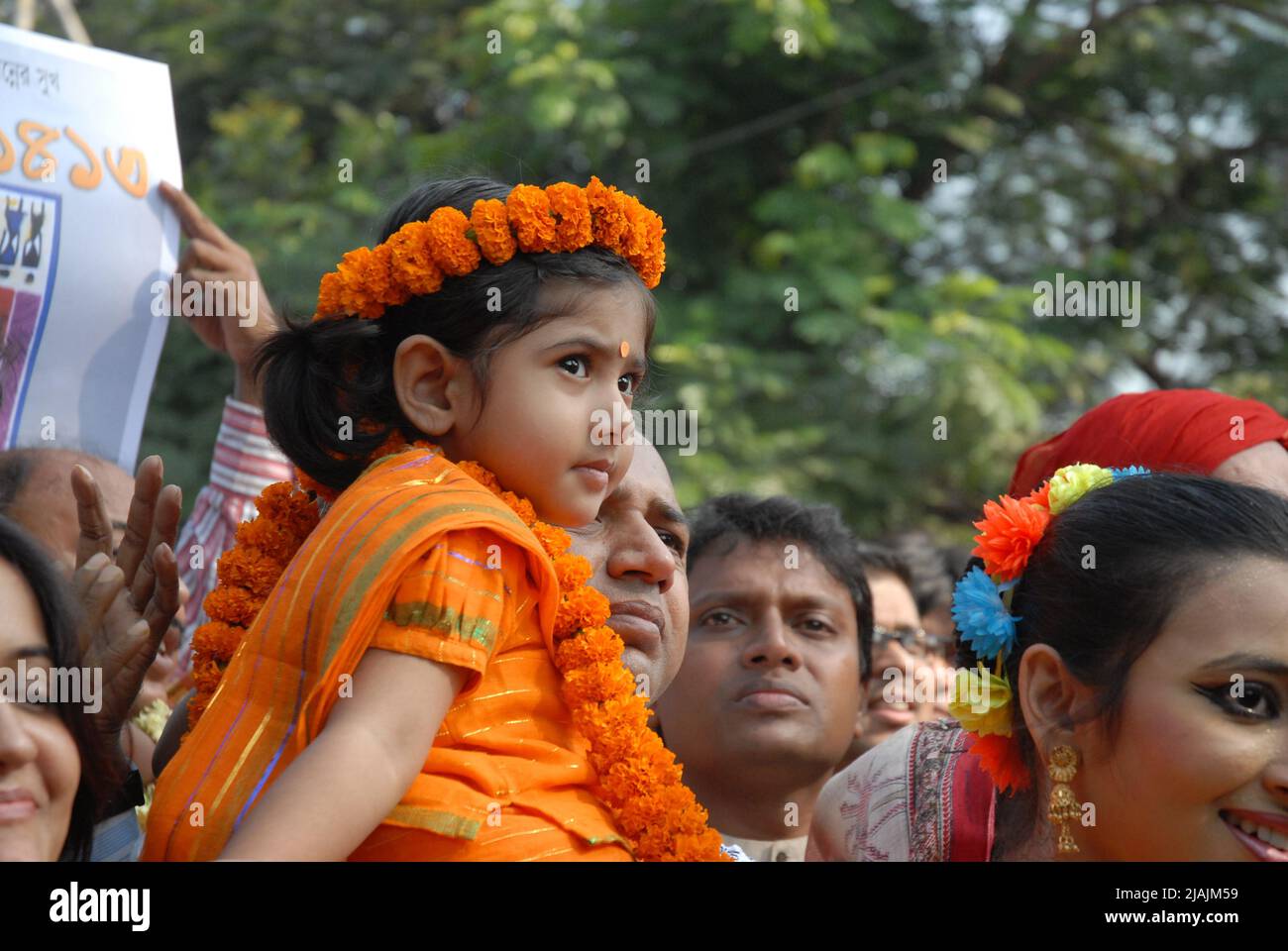 Dressed traditionally, men, women and children celebrate the occasion ...