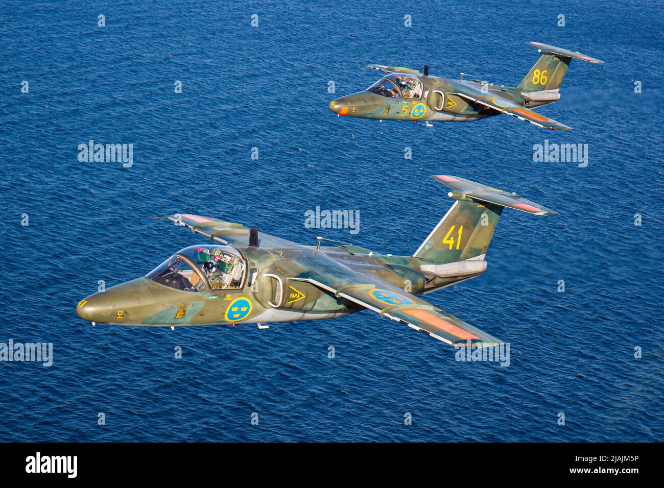 A pair of Swedish Air Force Sk60 training jets on a formation flight ...