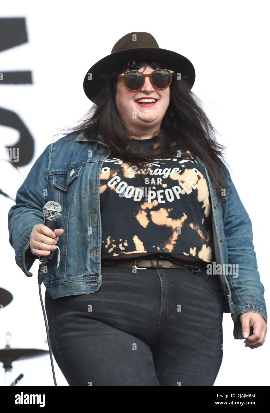 Singer Julie Rhodes is shown performing on stage during a live concert ...
