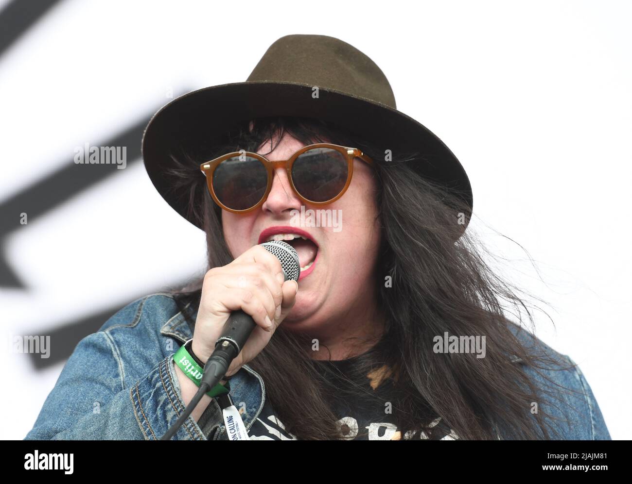 Singer Julie Rhodes is shown performing on stage during a live concert ...