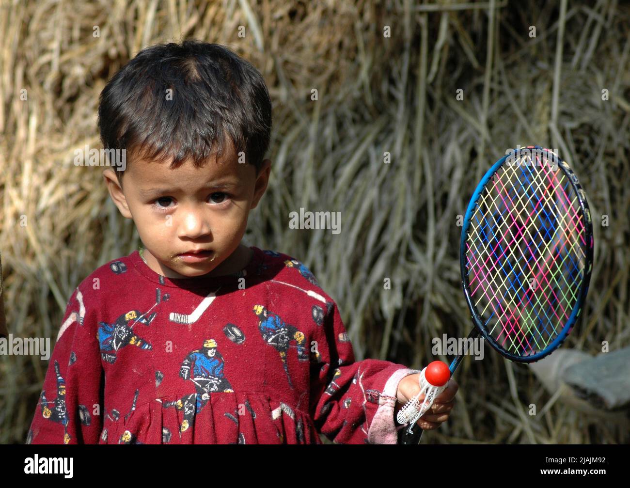 A rural chid all ready for a game Stock Photo - Alamy