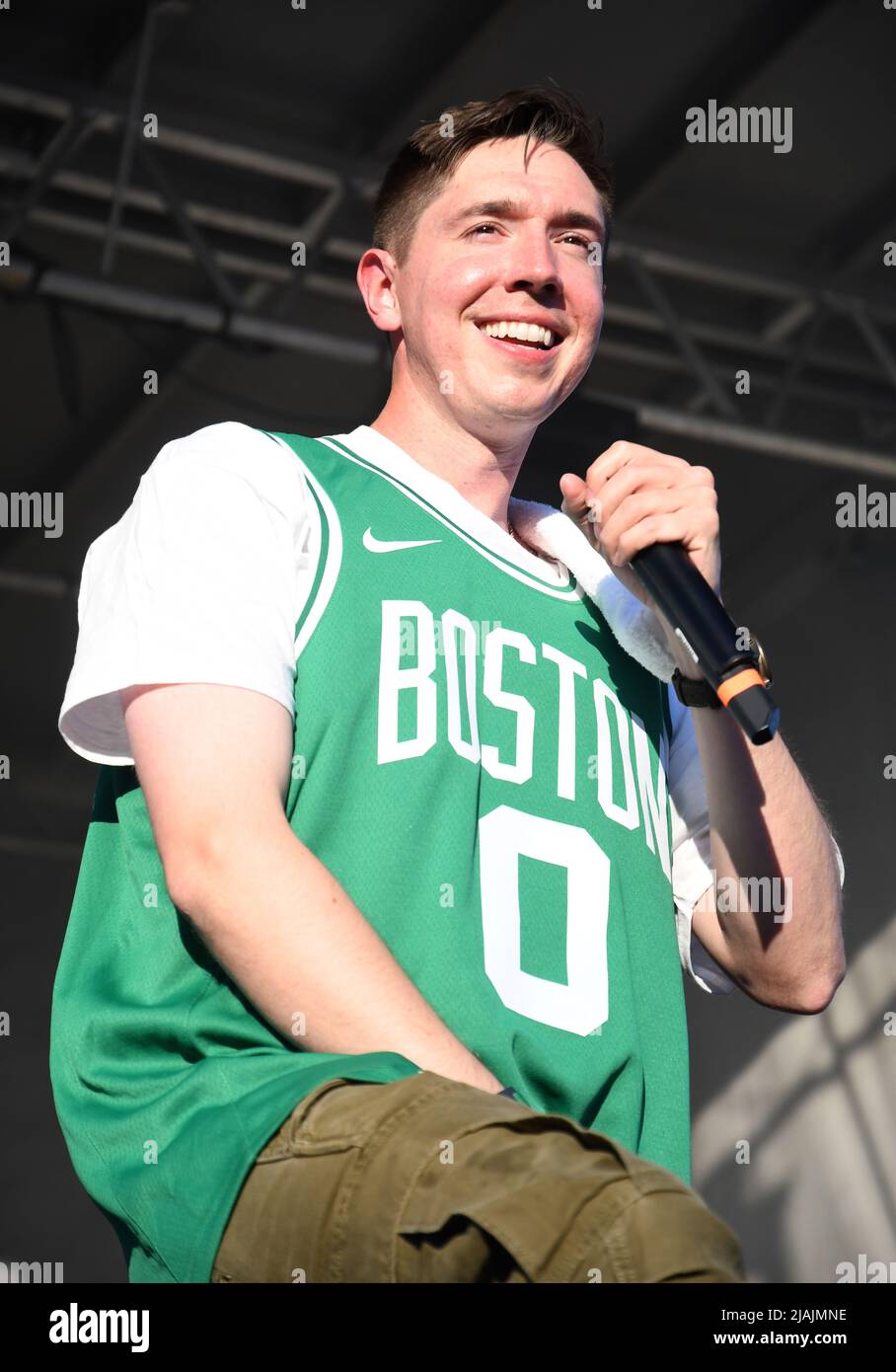 Rapper Cam Meekins is shown performing on stage during a live concert ...