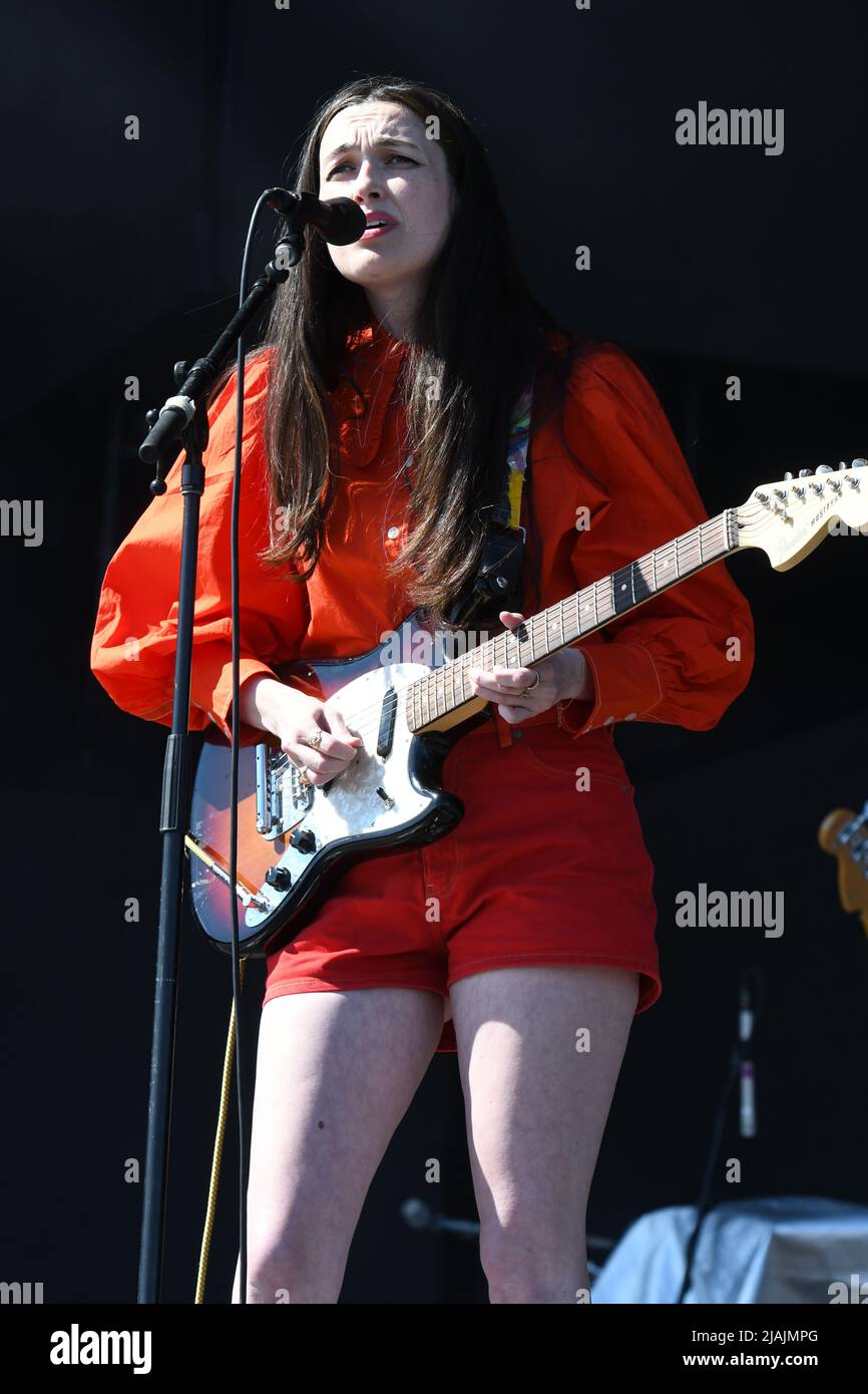 Singer Madeline Follin is shown performing on stage during a live ...