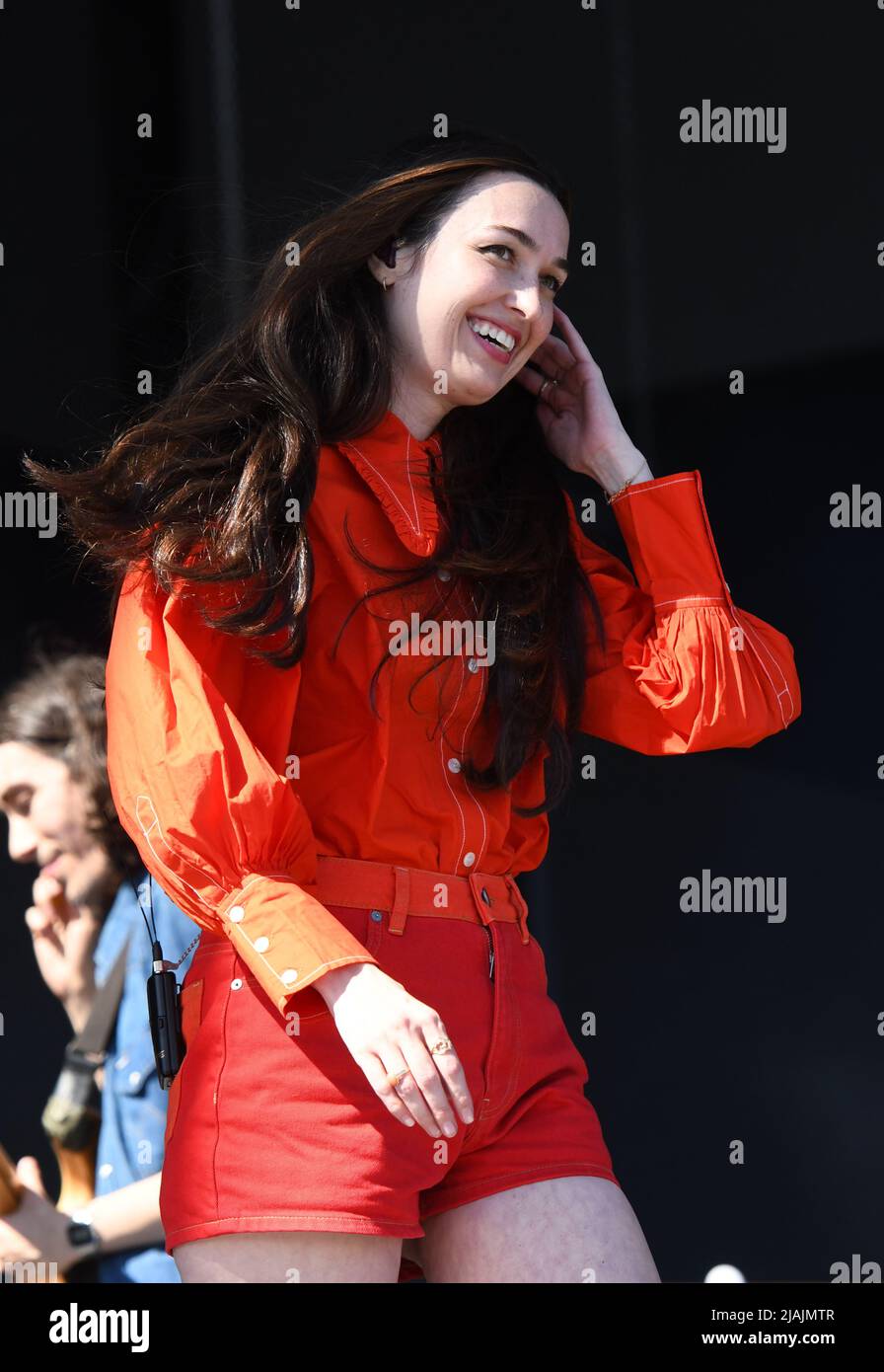 Singer Madeline Follin is shown performing on stage during a live ...