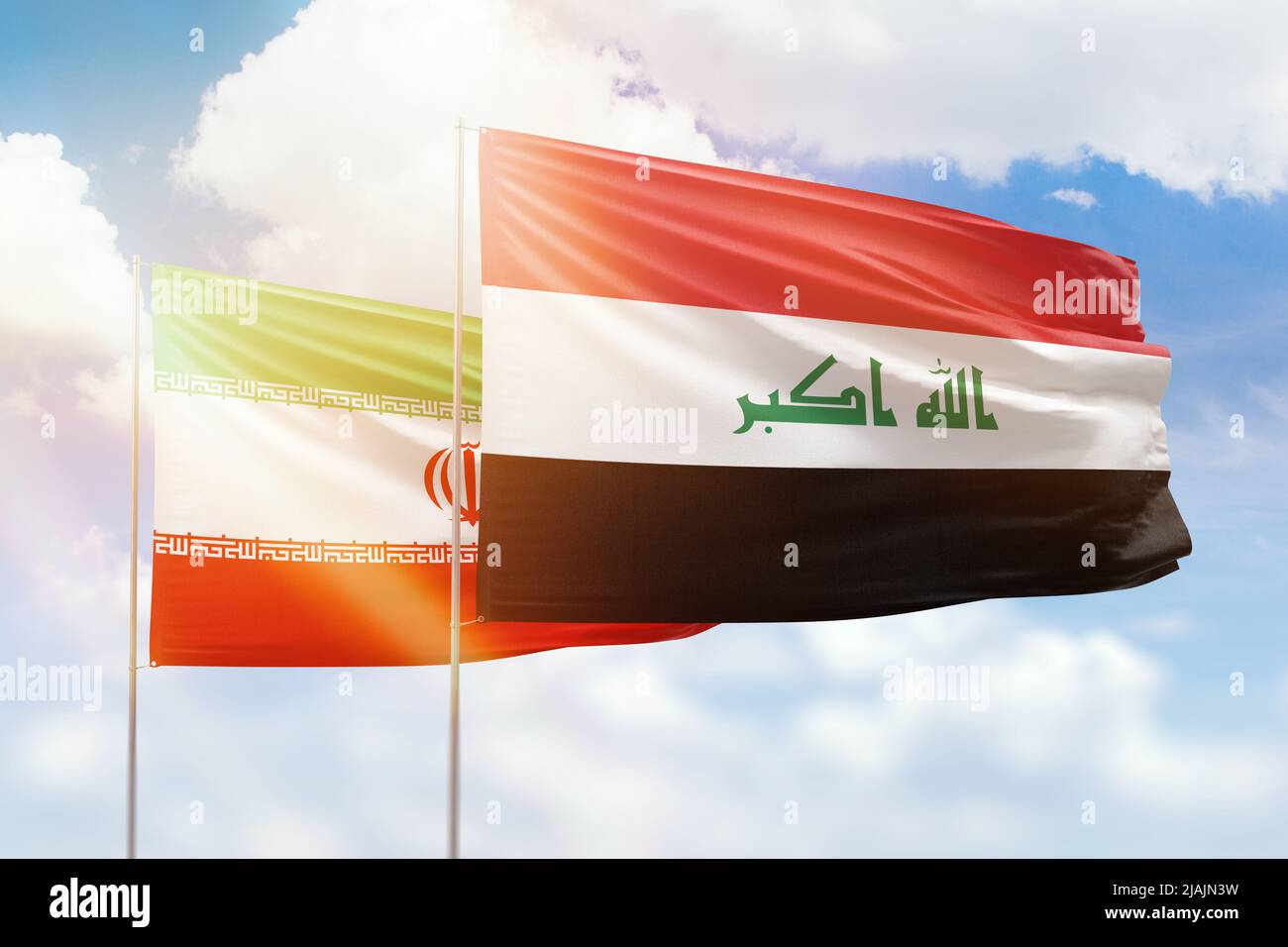 Sunny blue sky and flags of iraq and iran Stock Photo - Alamy