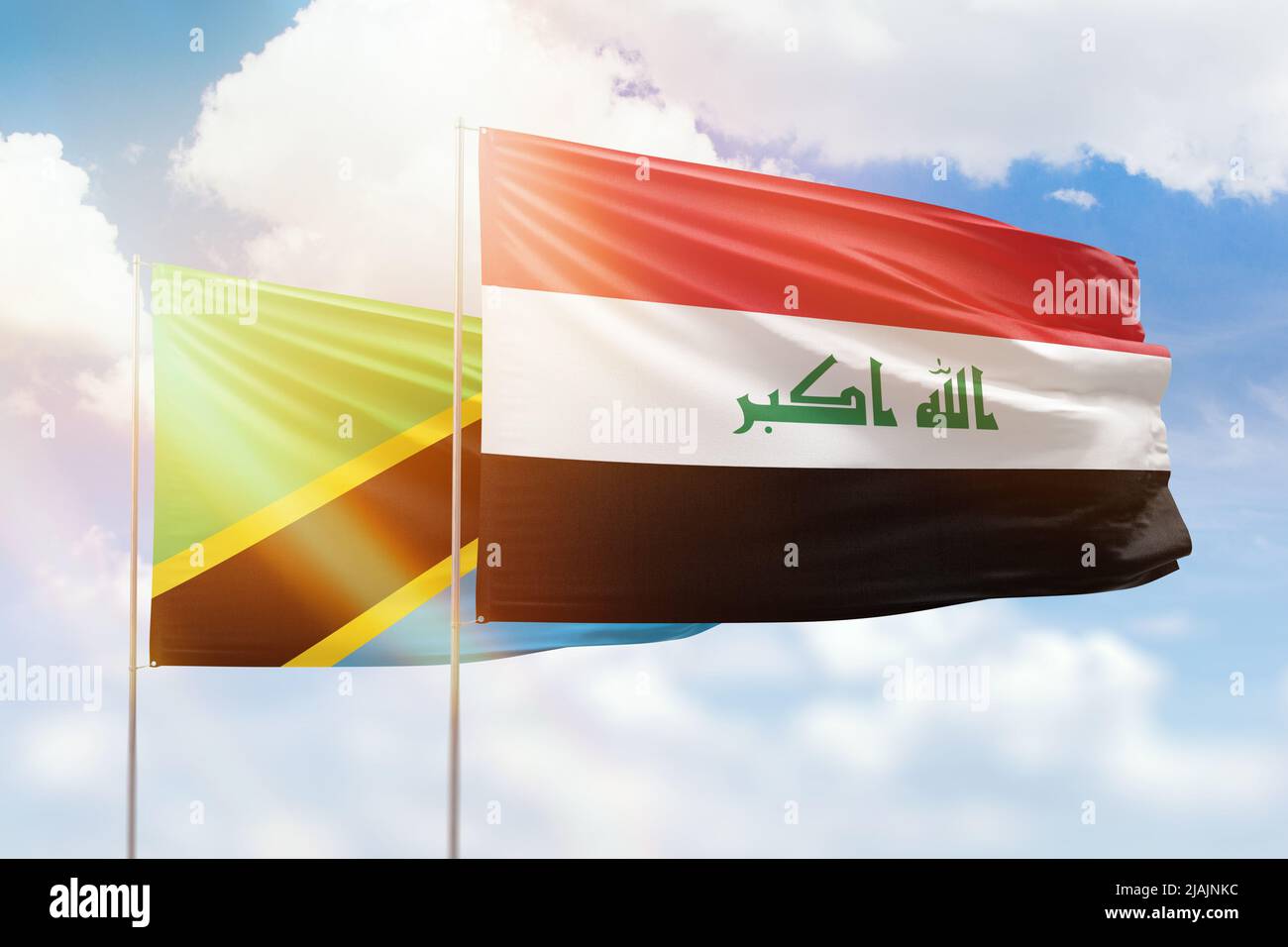 Sunny blue sky and flags of iraq and tanzania Stock Photo - Alamy