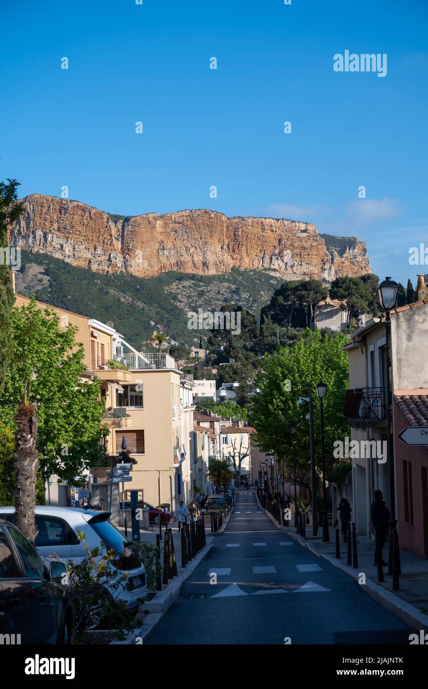 Sunny day in April in South of France, narrow streets and colorful ...