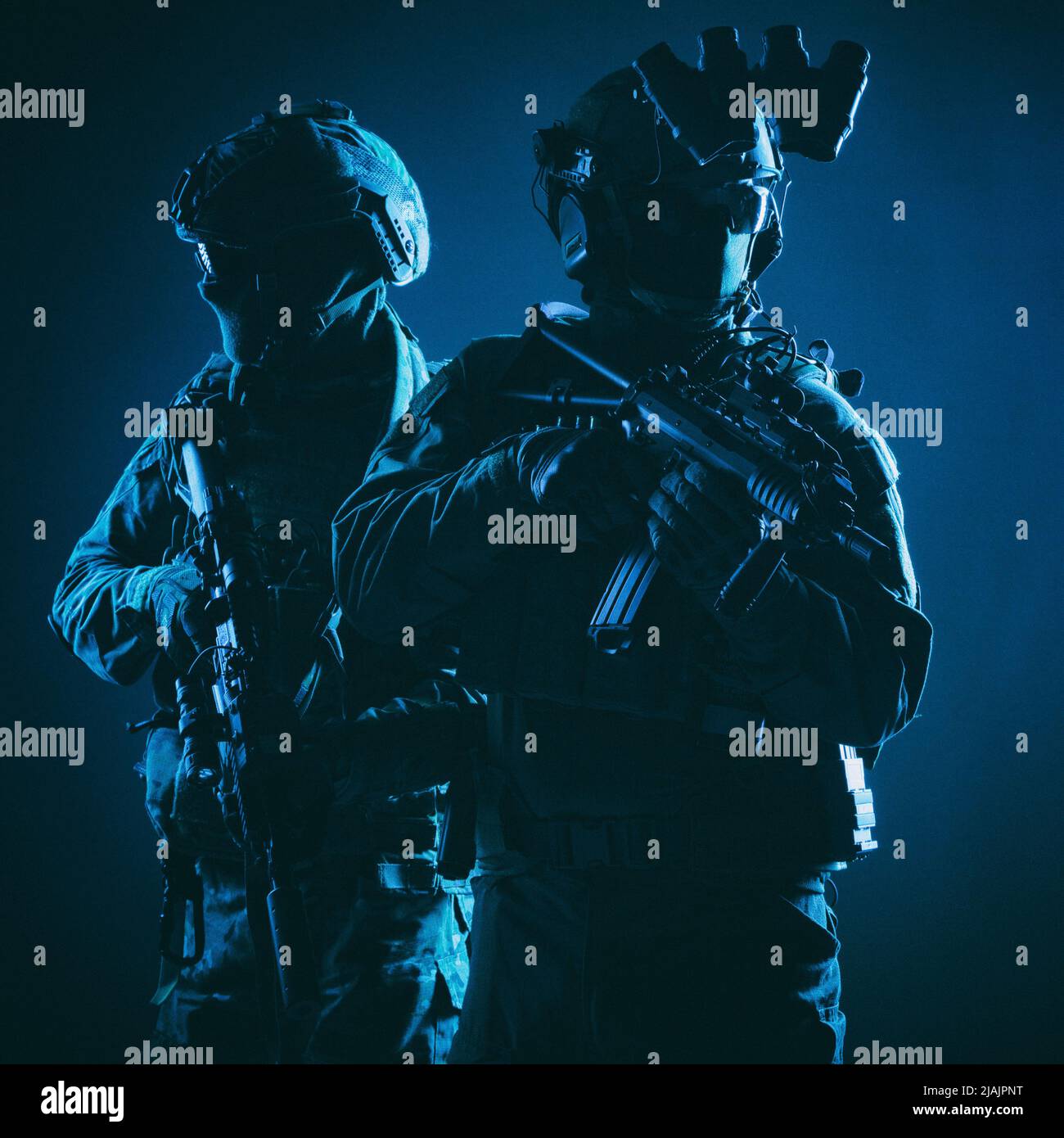 Two commando fighters with modern tactical ammunition, standing ...