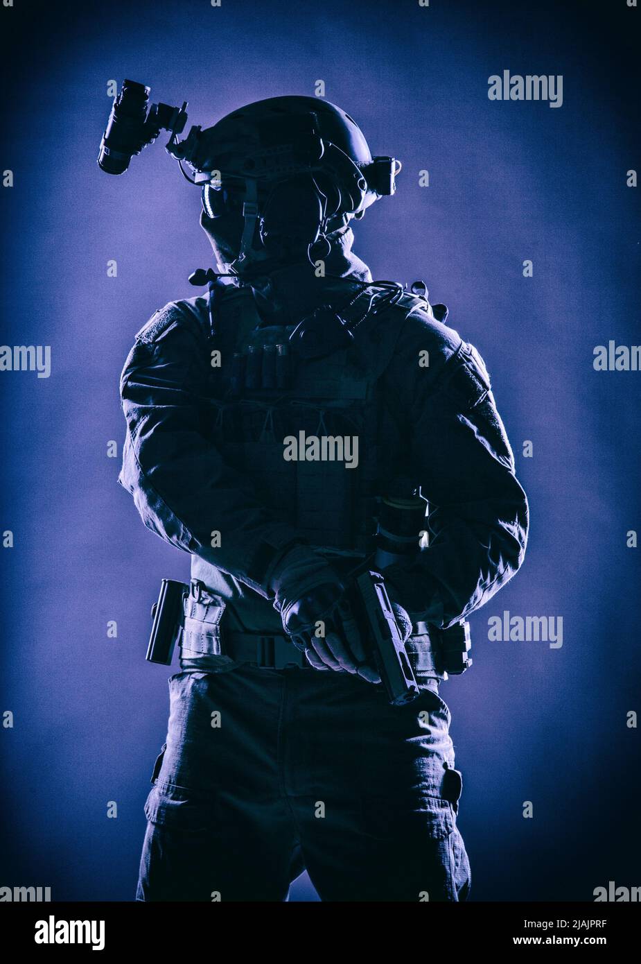 Army special forces soldier with night vision device and pistol ...