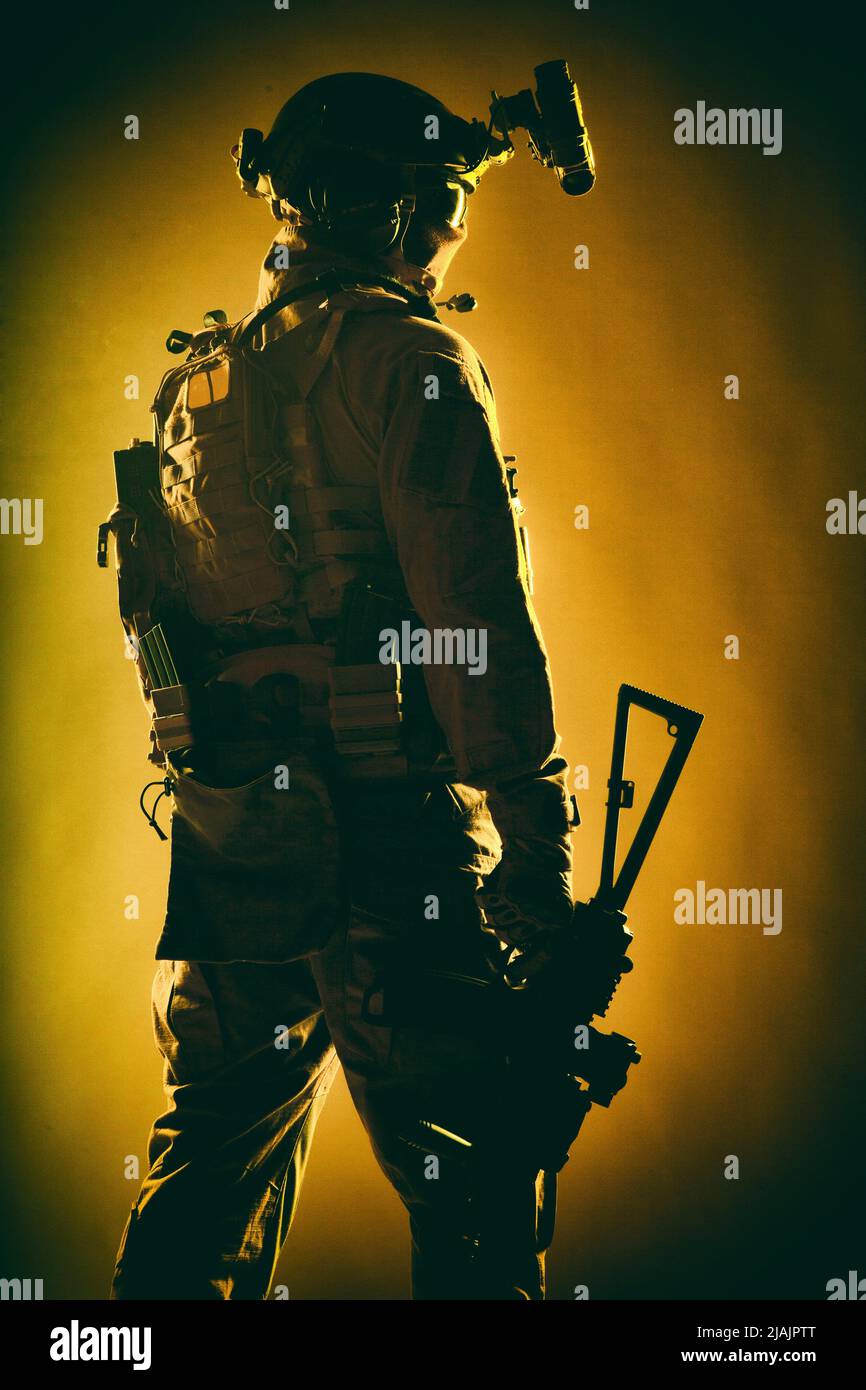 Soldier equipped in tactical ammunition and night vision device on ...
