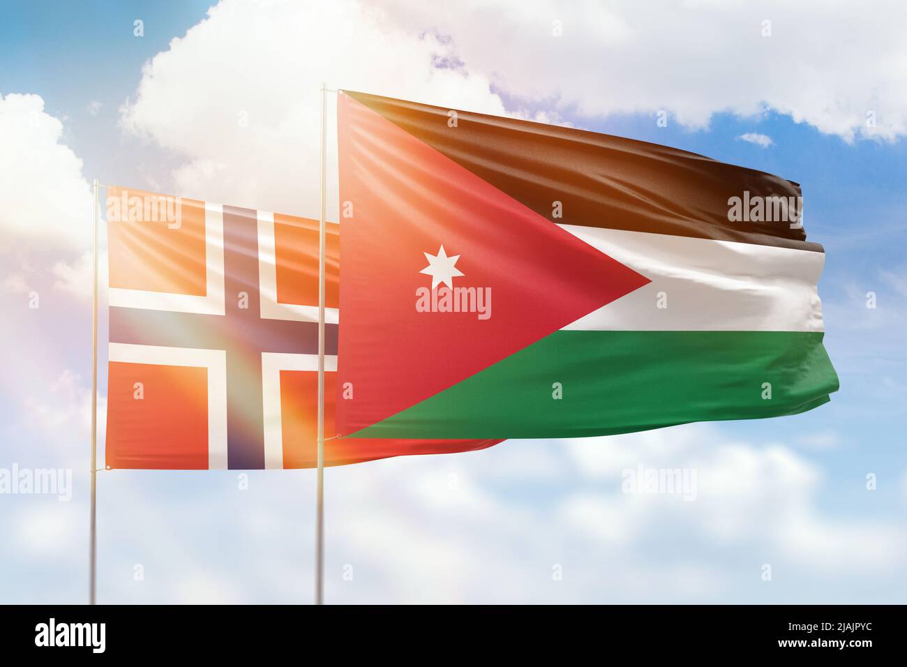 Sunny blue sky and flags of jordan and norway Stock Photo - Alamy