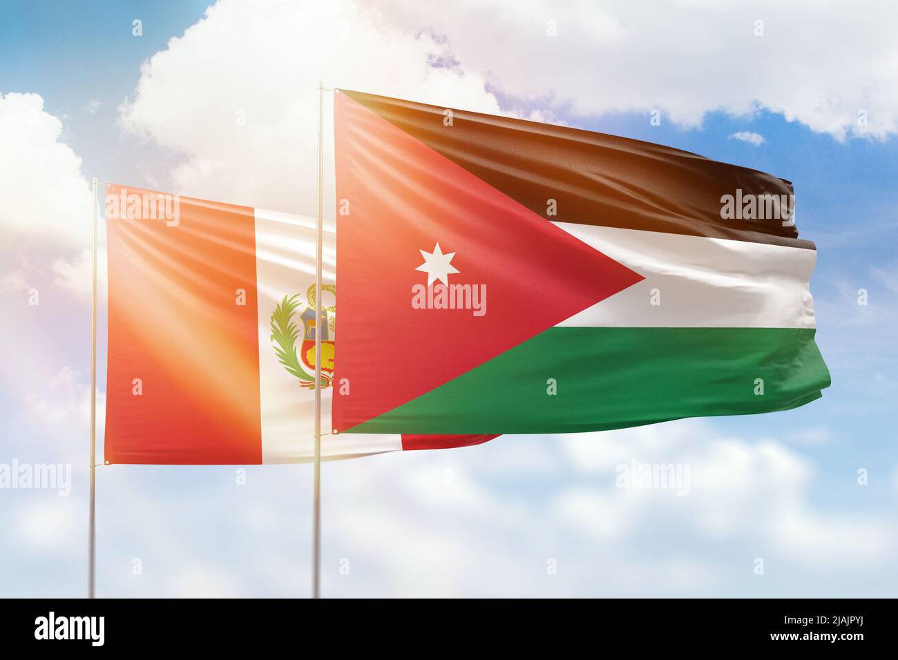Sunny blue sky and flags of jordan and peru Stock Photo - Alamy