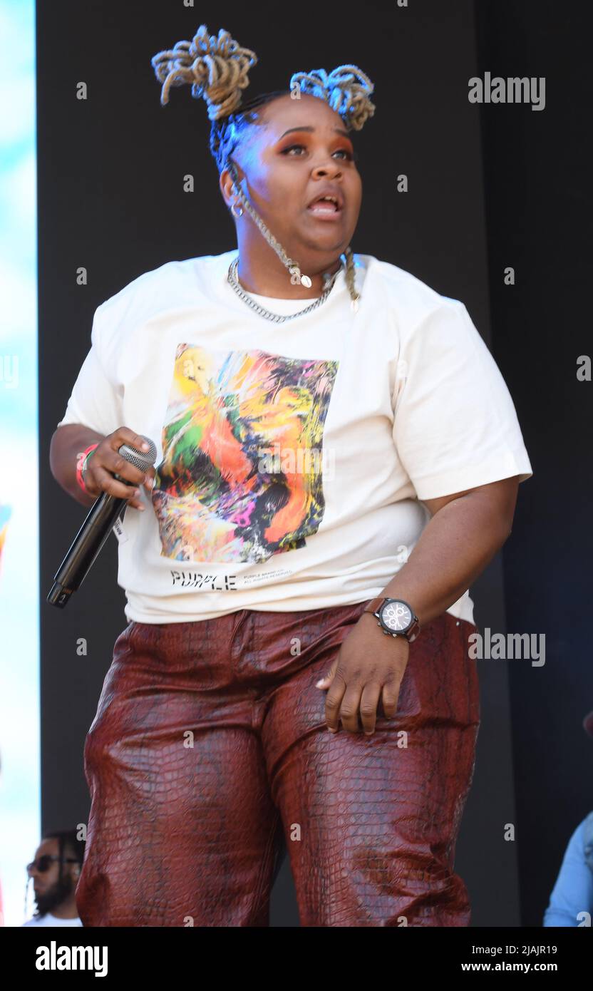 Poet, rapper, and educator, Oompa is shown performing on stage during a ...