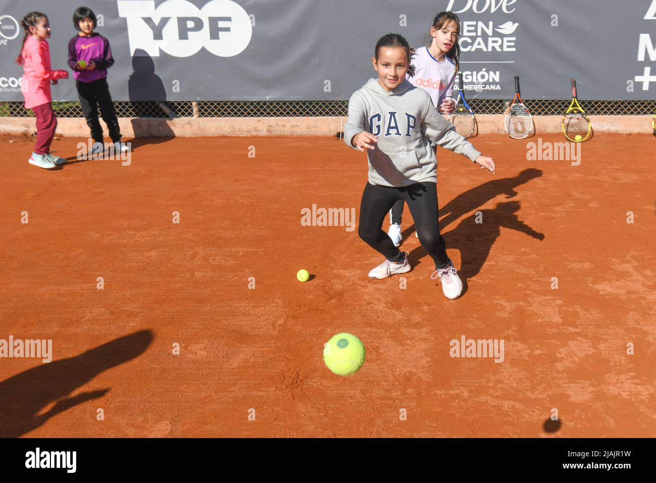 Little girls learning tennis Stock Photo - Alamy