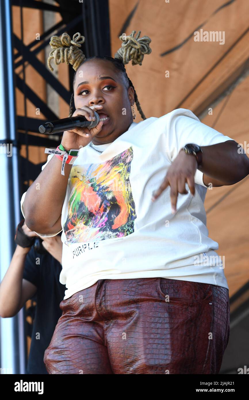 Poet, rapper, and educator, Oompa is shown performing on stage during a ...