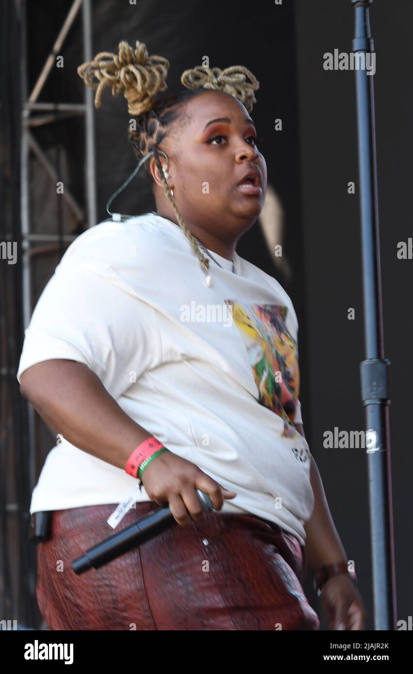 Poet, rapper, and educator, Oompa is shown performing on stage during a ...
