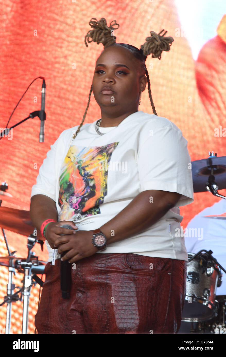 Poet, rapper, and educator, Oompa is shown performing on stage during a ...