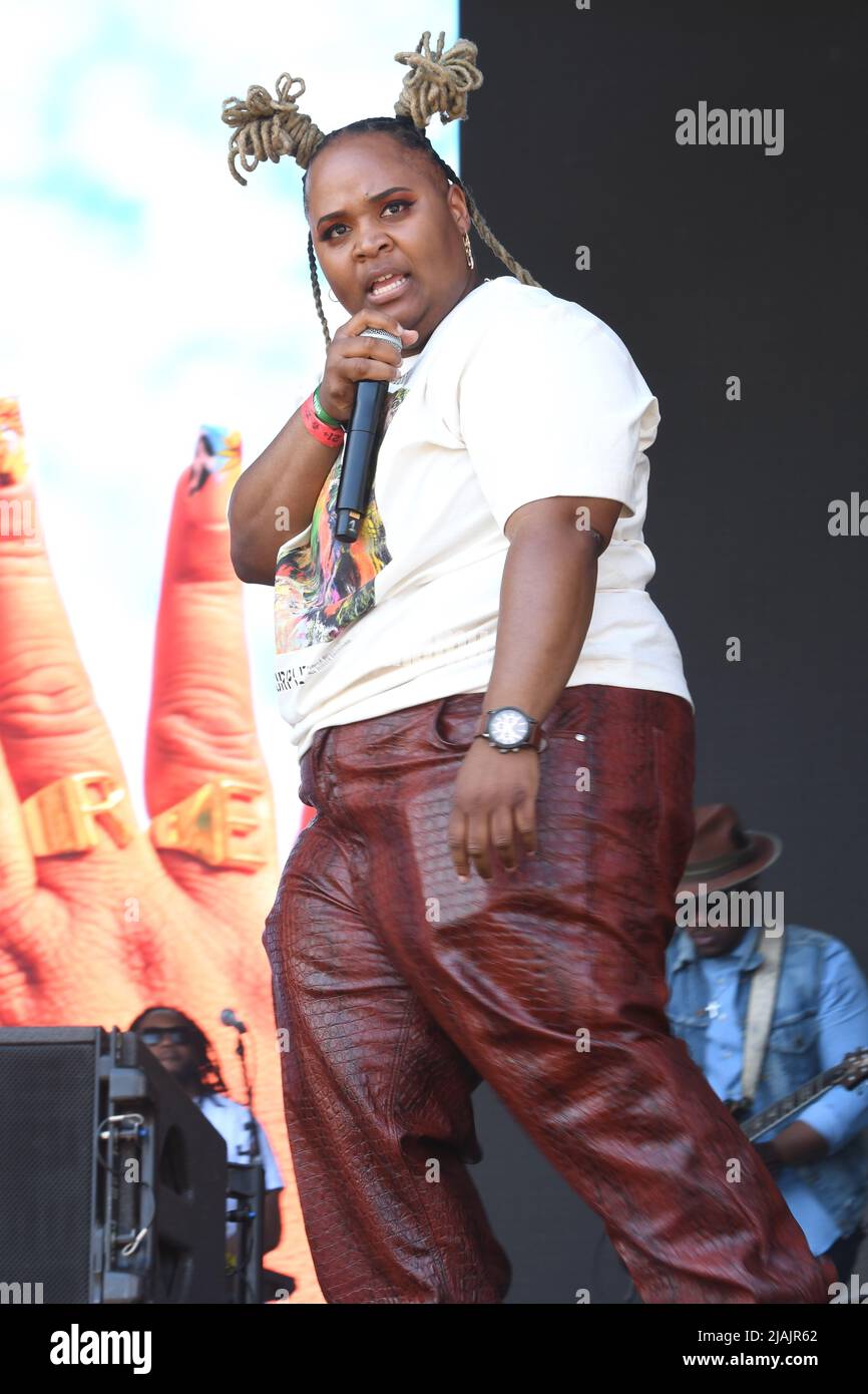 Poet, rapper, and educator, Oompa is shown performing on stage during a ...