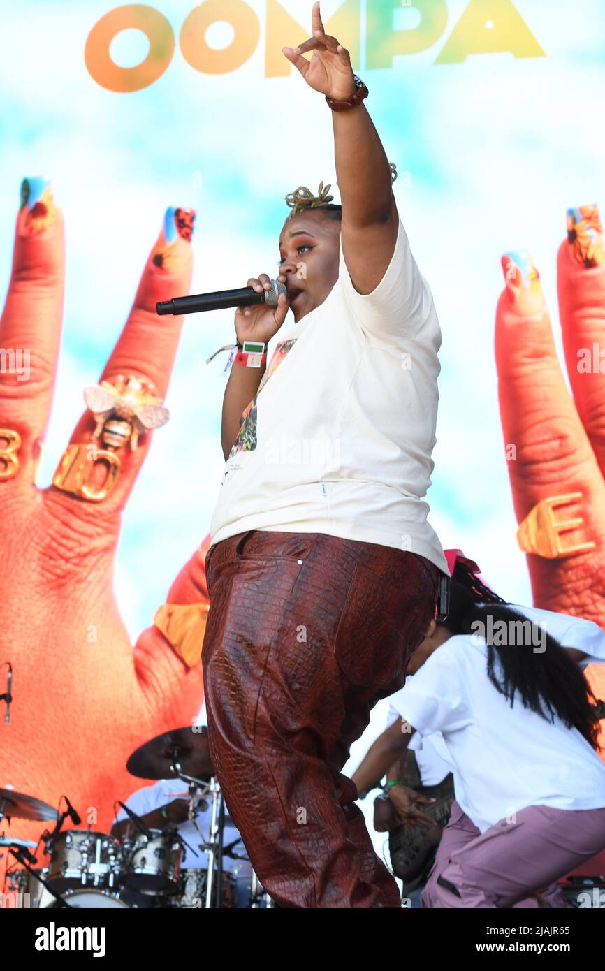 Poet, rapper, and educator, Oompa is shown performing on stage during a ...