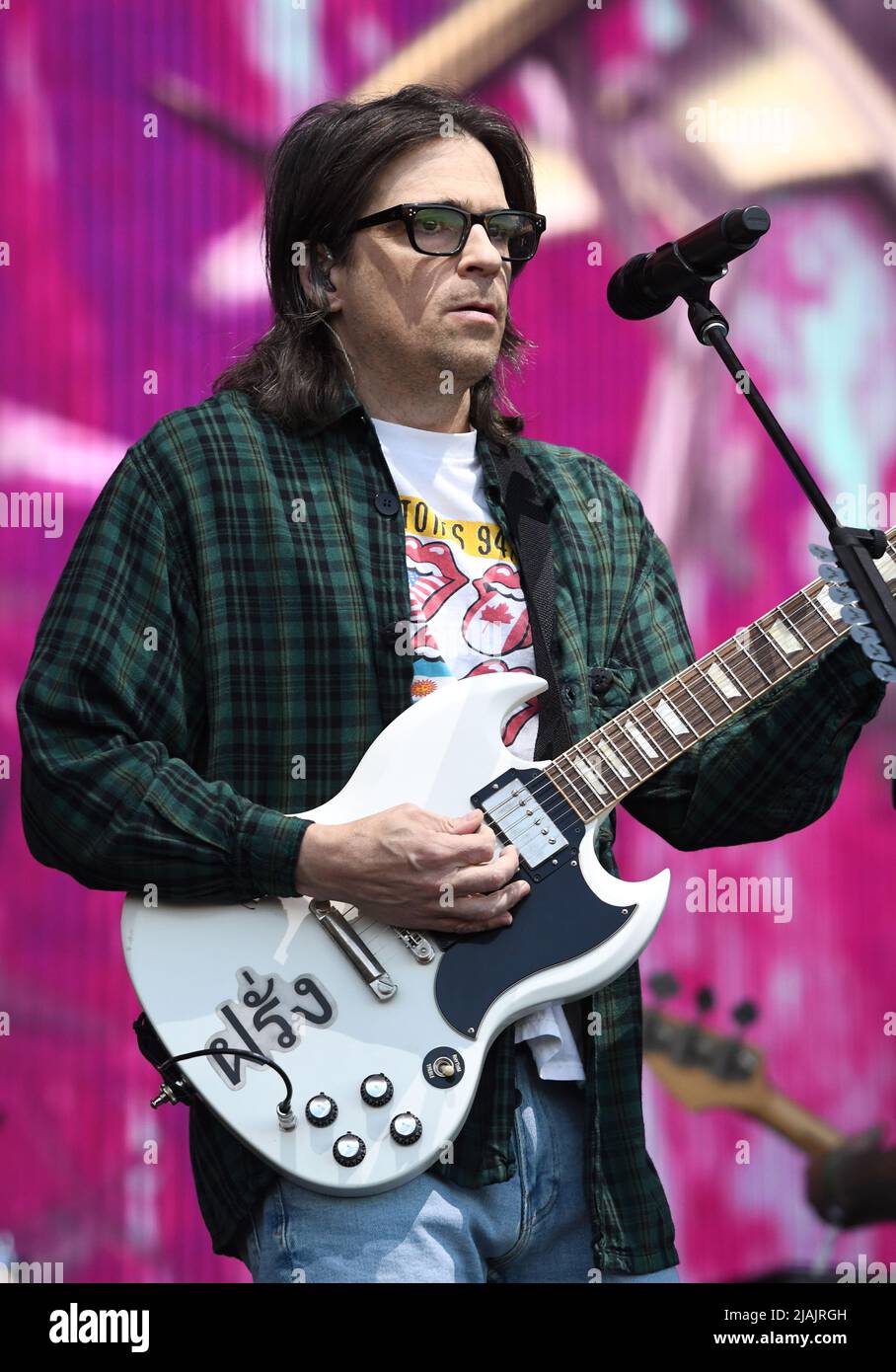 Singer, songwriter and guitarist Rivers Cuomo is shown performing on ...