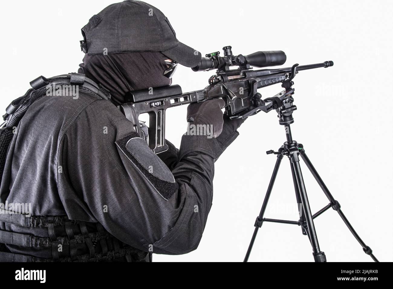 SWAT team sniper in black uniform and mask, aiming with sniper rifle ...