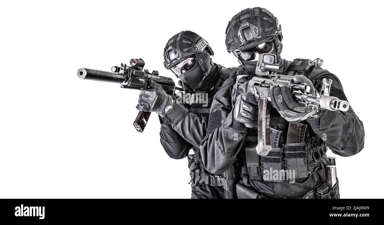 Two SWAT team fighters in black uniforms, armed with assault rifles ...