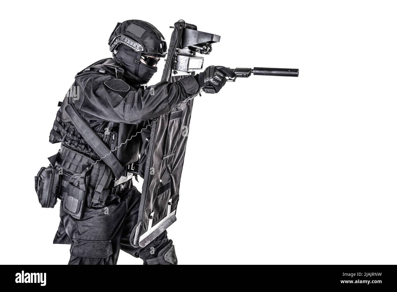 SWAT team fighter hiding behind ballistic shield and aiming pistol ...