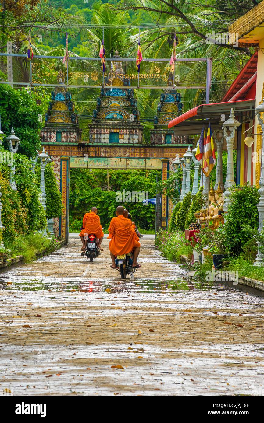 An Giang Province, Vietnam - May 01, 2022 : Khmer monks riding scooter on rural road in Mekong ...