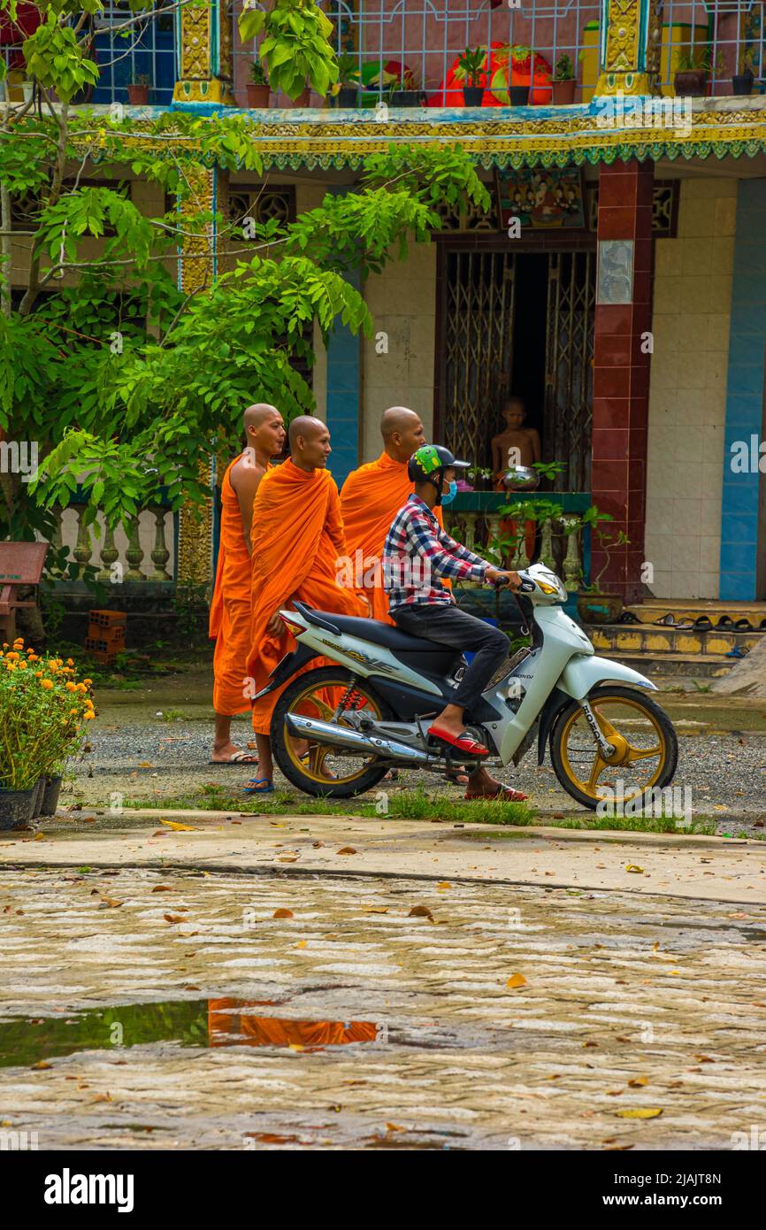 An Giang Province, Vietnam - May 01, 2022 : Khmer monks riding scooter on rural road in Mekong ...