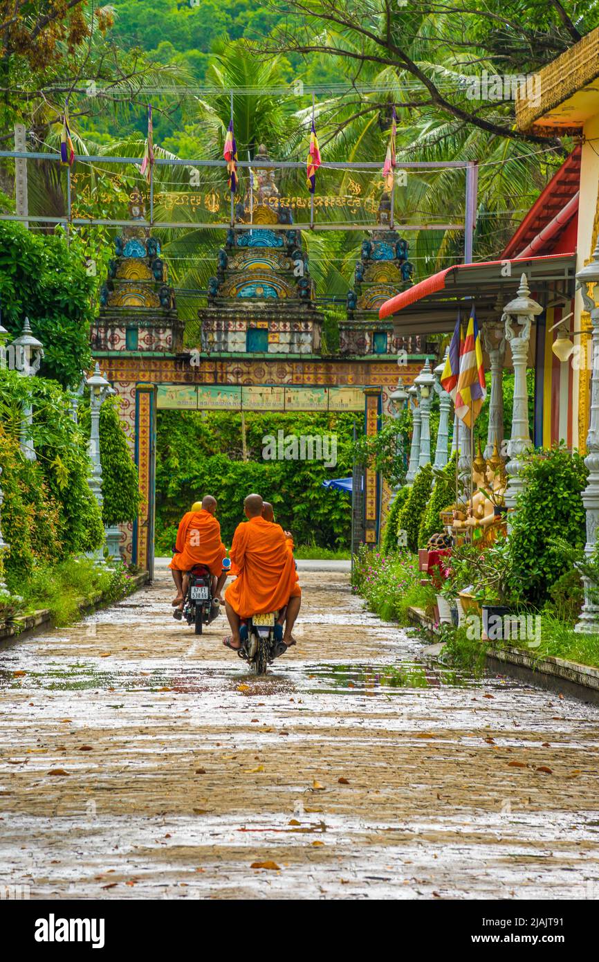 An Giang Province, Vietnam - May 01, 2022 : Khmer monks riding scooter on rural road in Mekong ...