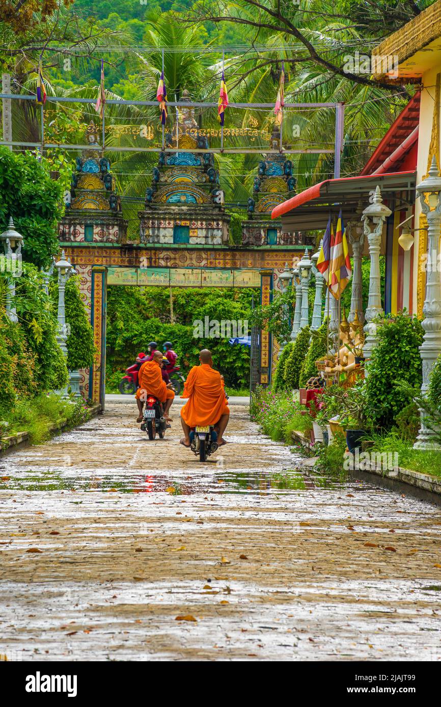 An Giang Province, Vietnam - May 01, 2022 : Khmer monks riding scooter on rural road in Mekong ...