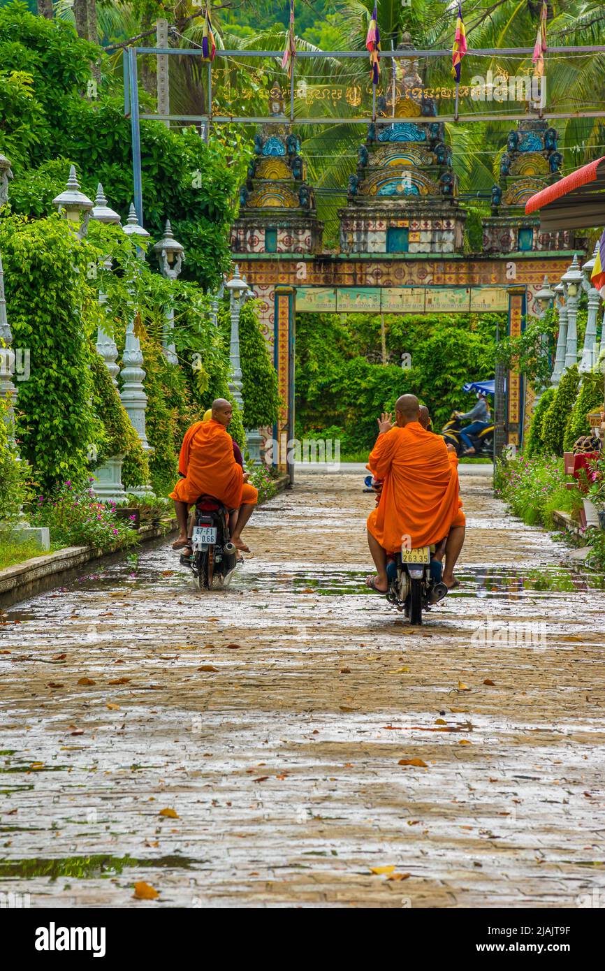 An Giang Province, Vietnam - May 01, 2022 : Khmer monks riding scooter on rural road in Mekong ...