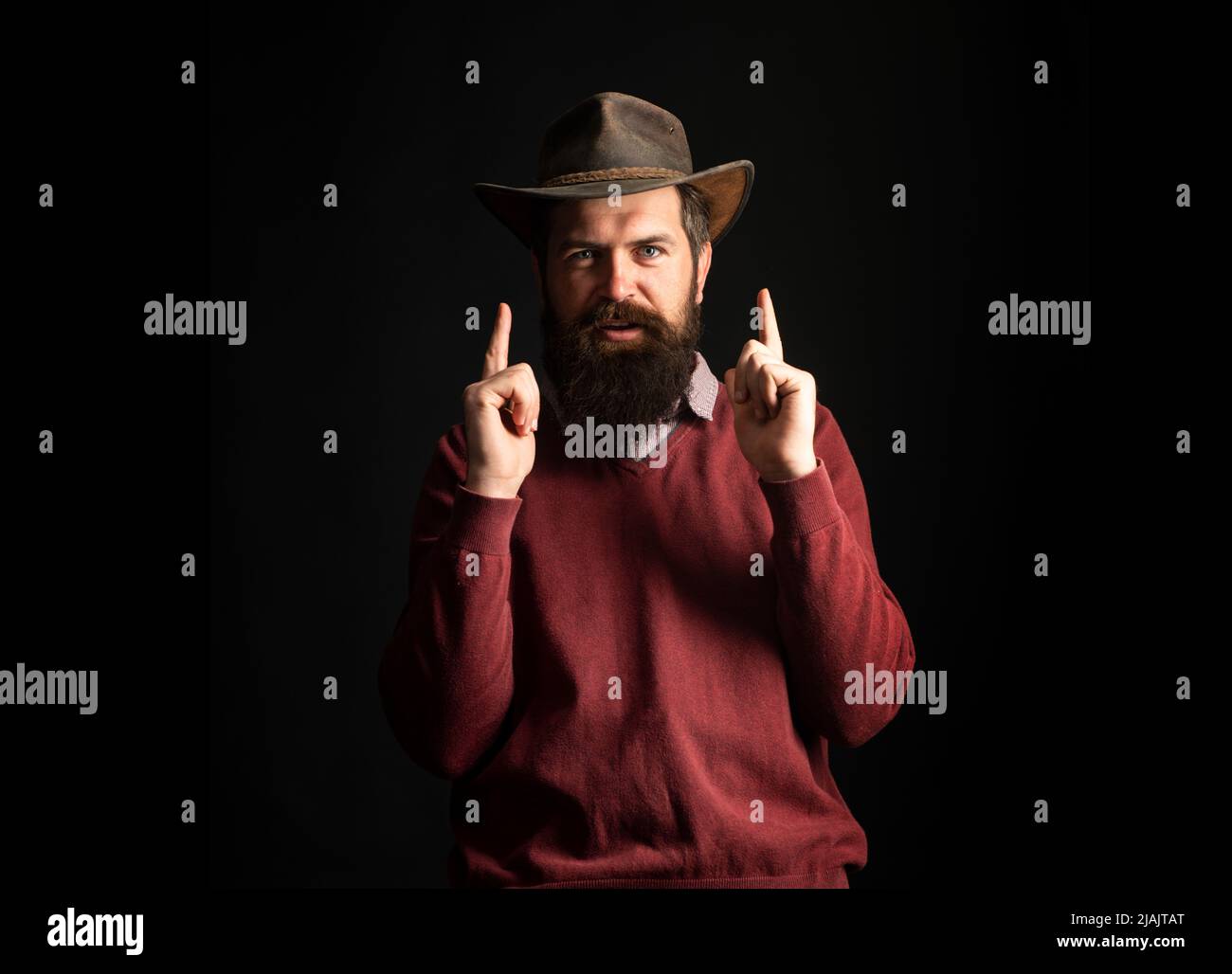 Funny cowboy man in cowboy hat. Wild west guns, finger revolver ...