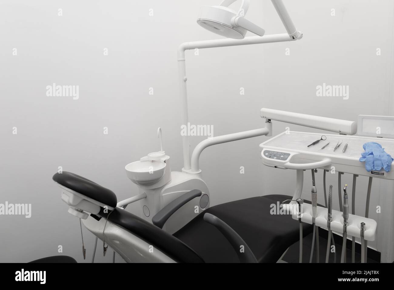 dental office interior equipped with dental chair, lamp and tools ...