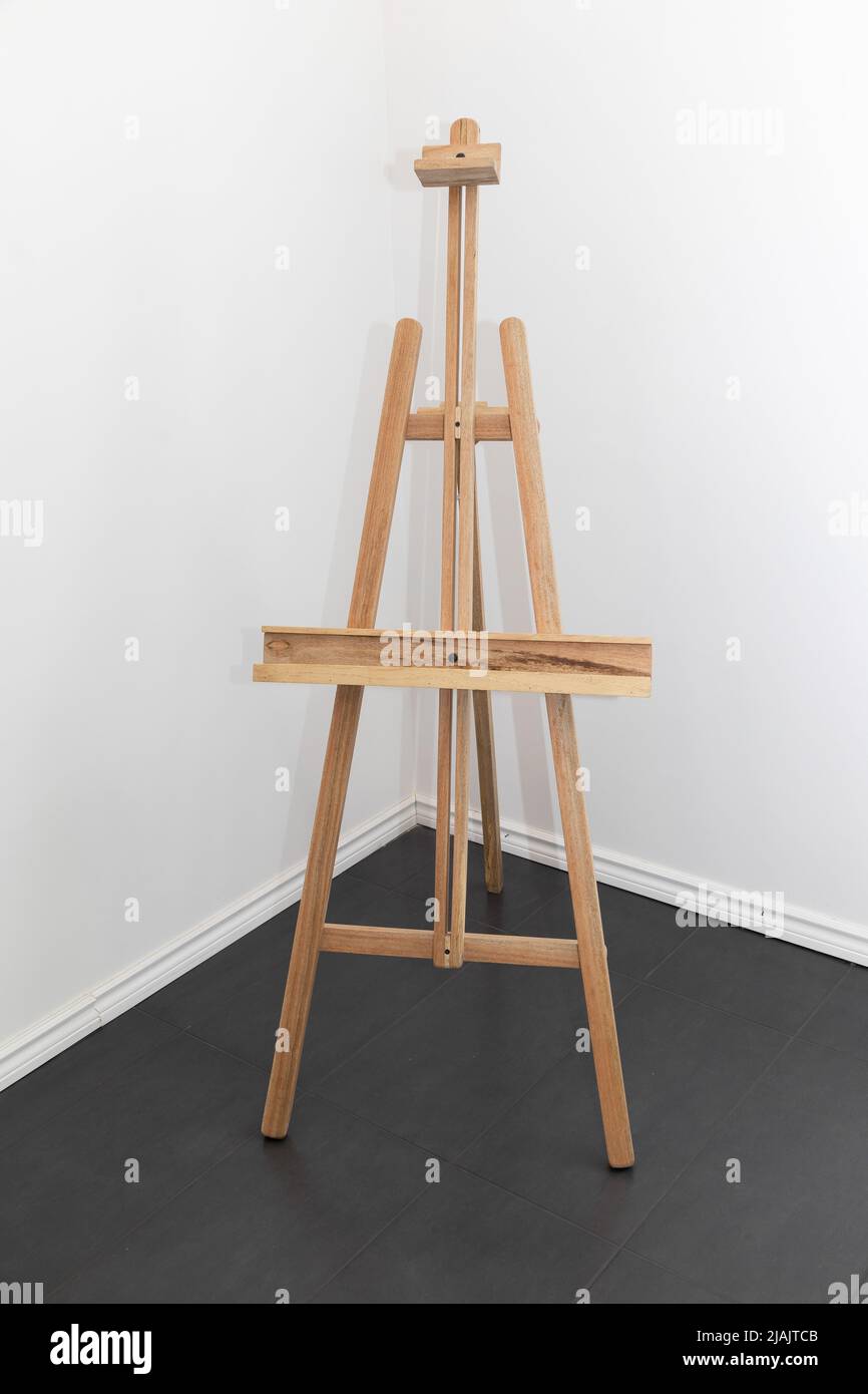 details of empty and standing wooden easel, artistic object decorating ...