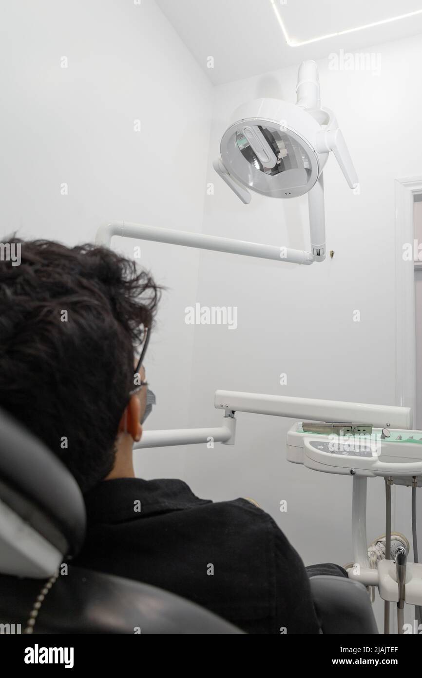 patient waiting sitting in a dentist chair, medical office interior ...