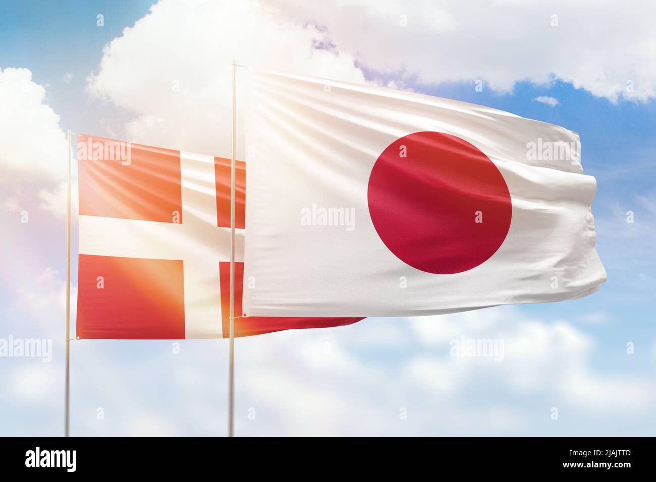 Sunny blue sky and flags of japan and denmark Stock Photo - Alamy