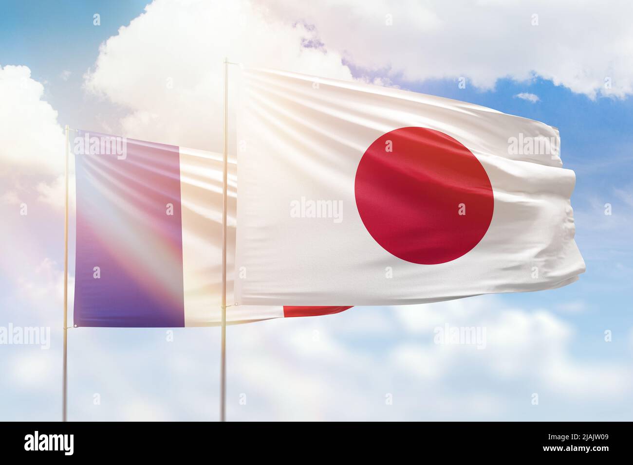 Sunny blue sky and flags of japan and france Stock Photo - Alamy