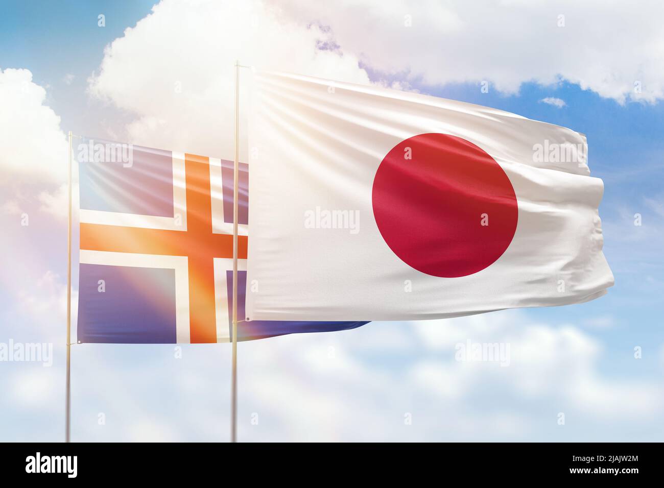 Sunny blue sky and flags of japan and iceland Stock Photo - Alamy