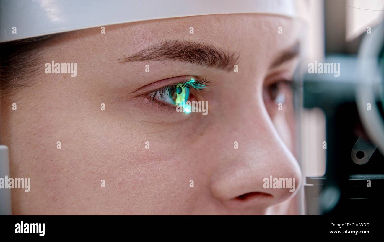 Ophthalmology treatment - a young woman checking her visual acuity ...