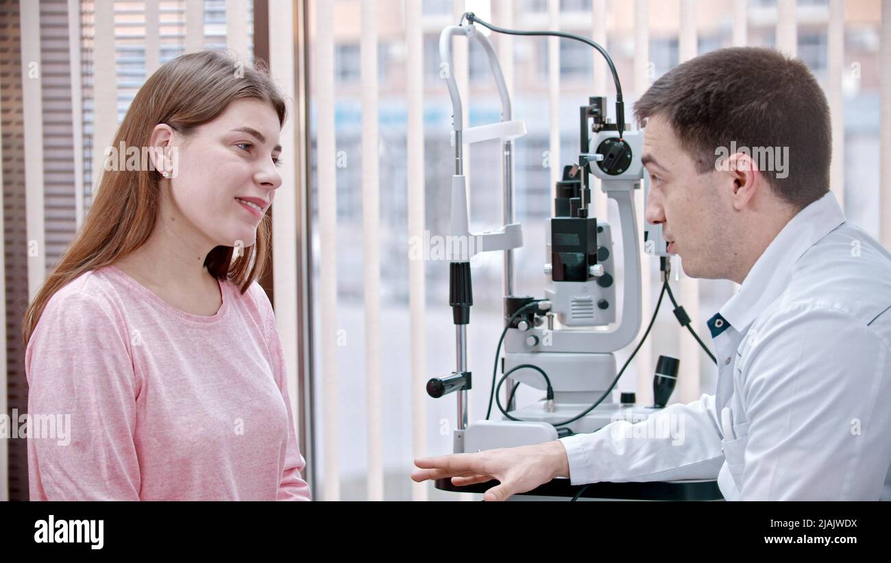 Ophthalmology treatment in the cabinet - young woman having a ...