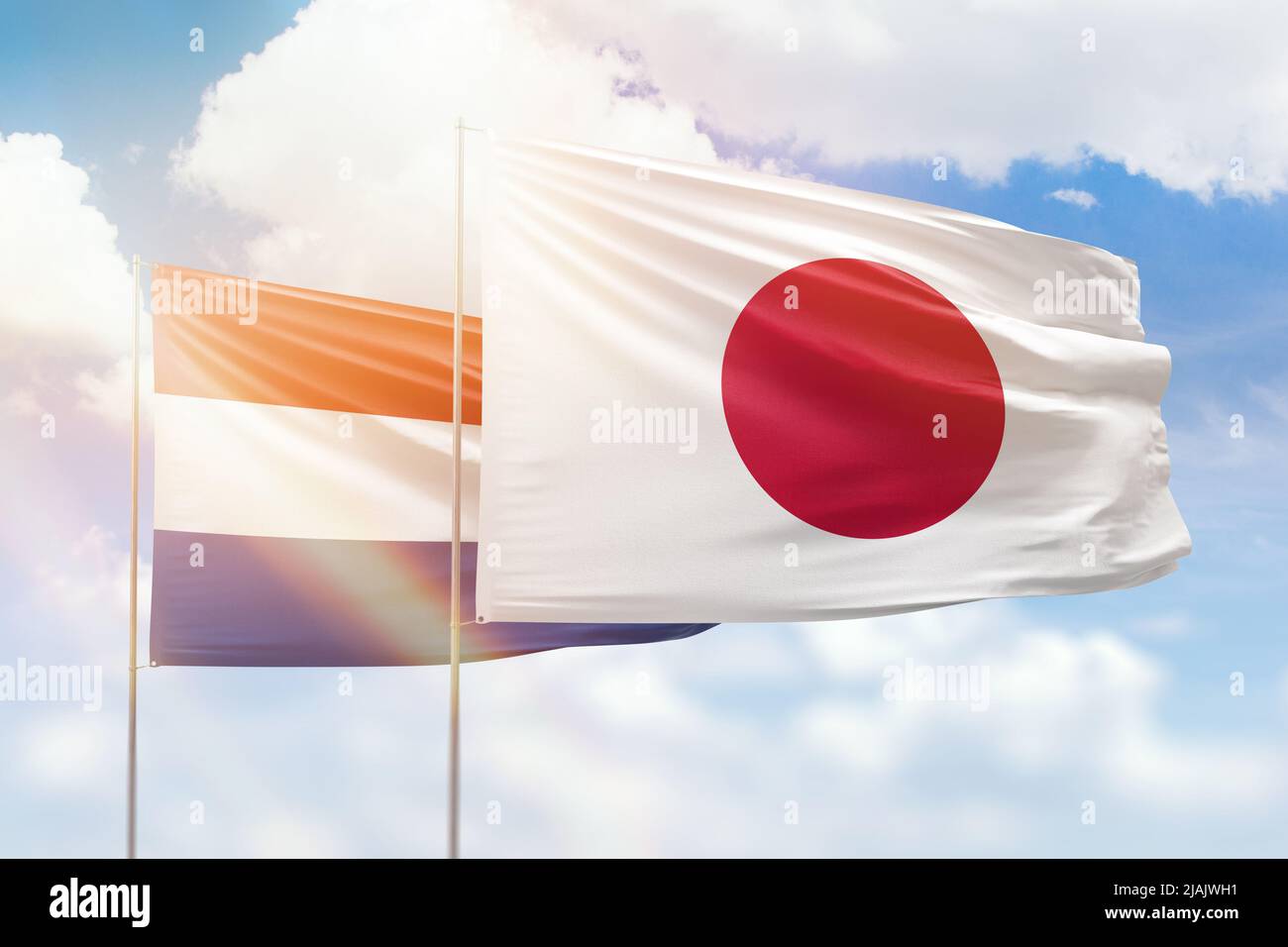 Sunny blue sky and flags of japan and netherlands Stock Photo - Alamy