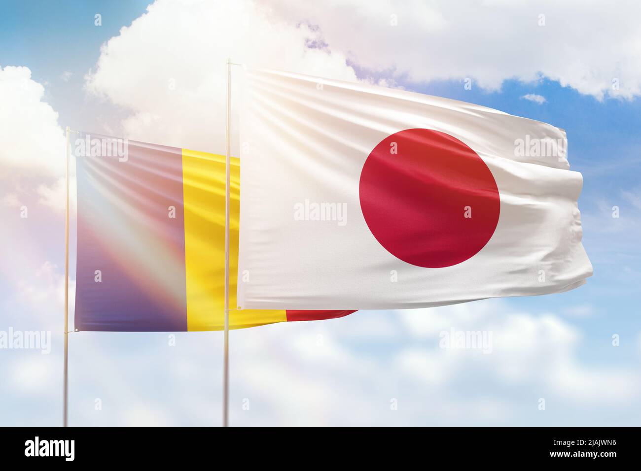 Sunny blue sky and flags of japan and romania Stock Photo - Alamy