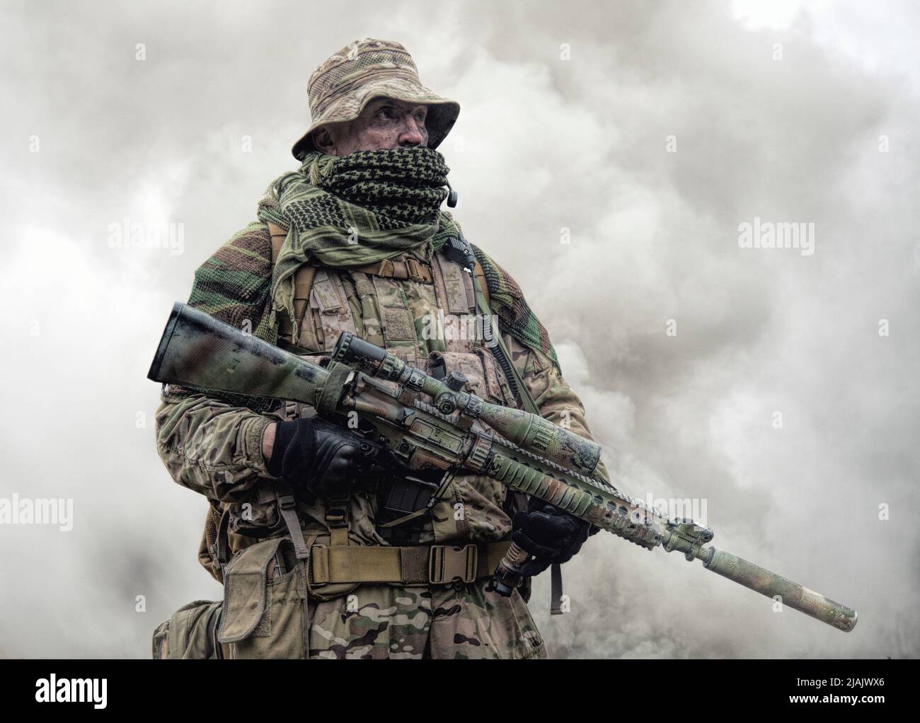 Elite commando fighter in camouflage uniform, armed with sniper rifle ...
