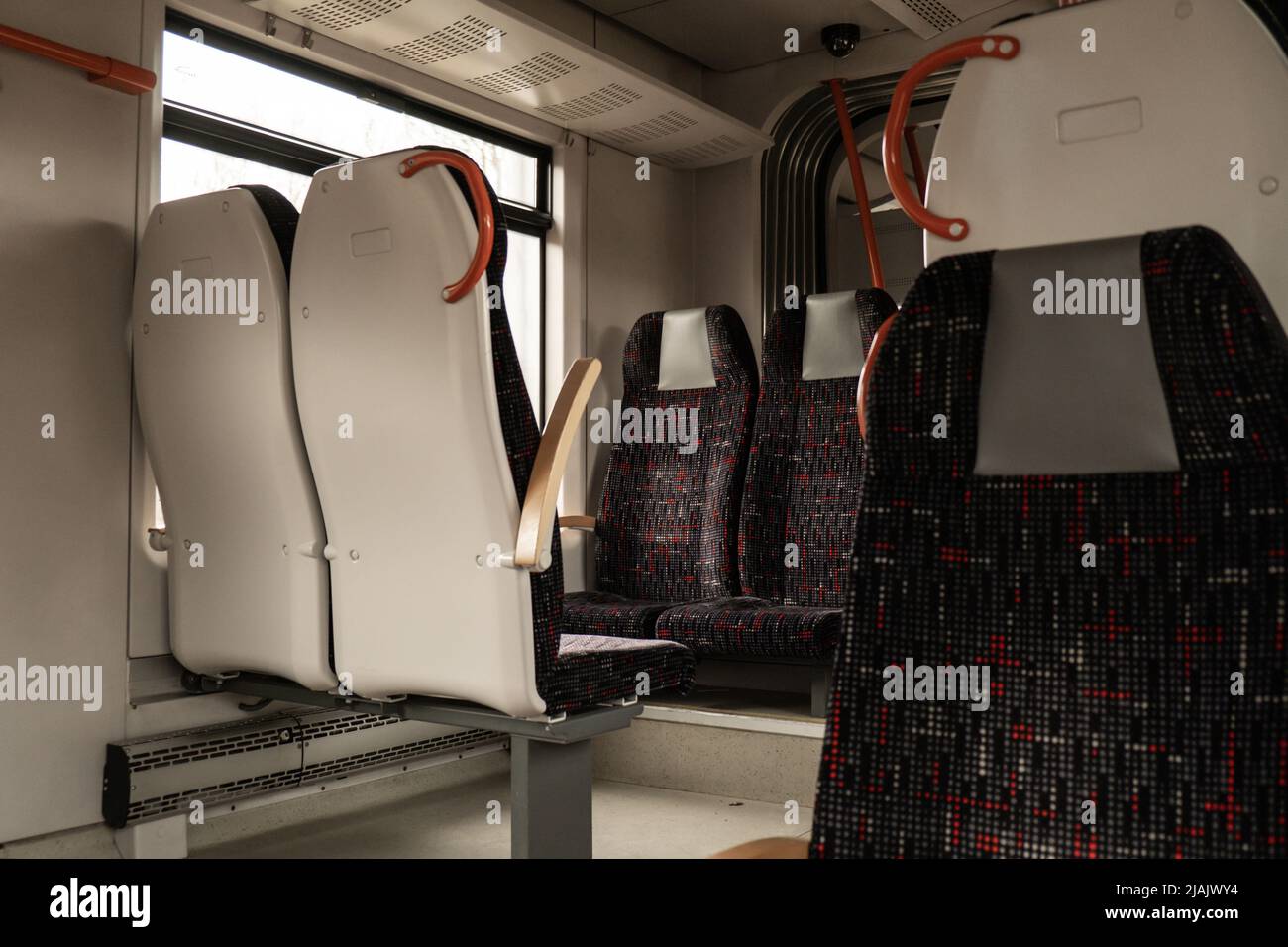 Interior view at trains empty seats window View on railroad track from ...